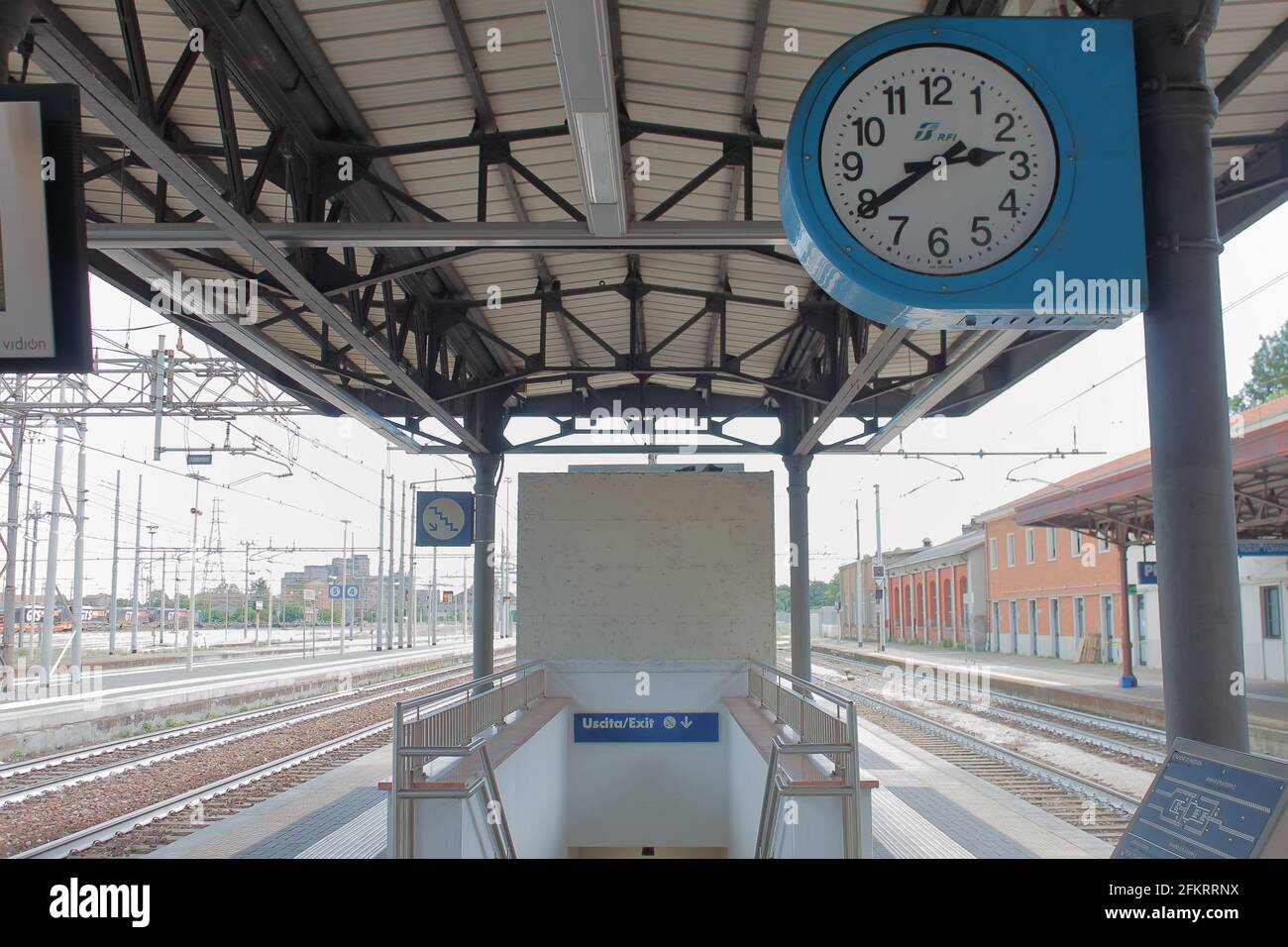 Big blue clock near the exit in the train station Stock Photo - Alamy
