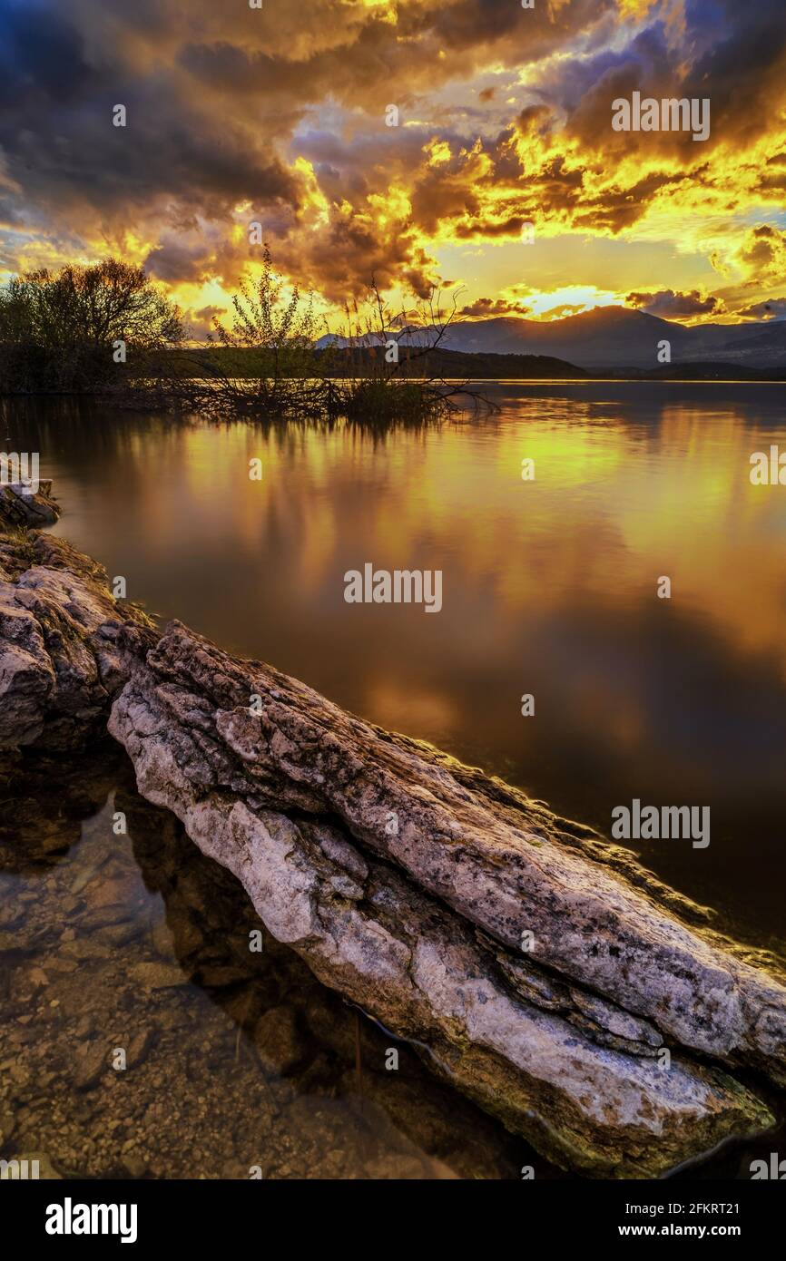 Vertical shot of a lake on a beautiful sunset background Stock Photo ...