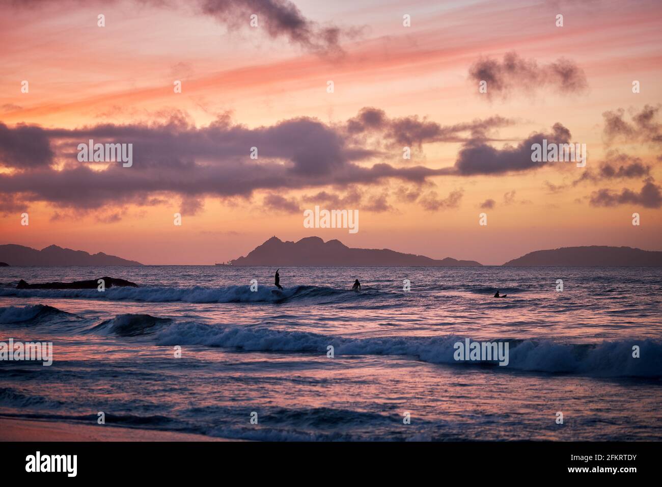 Breathtaking scenery of sunset with the colorful sky on a beach in the ...