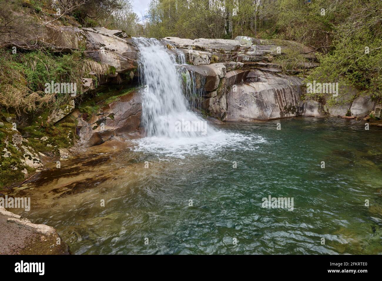 Natural pool formed in the rocks by the Cerves river in the community ...