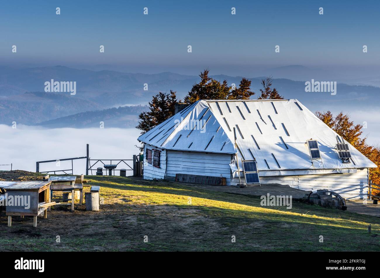 Beautiful white house over the clouds. Landscape from the mountain ...