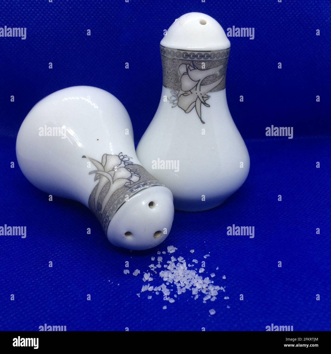 Salt spilt on the ground from the salt shaker Stock Photo - Alamy