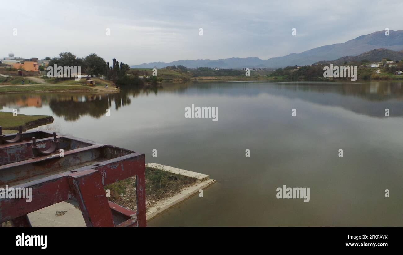 Beautiful lake surface with buildings on the shore Stock Photo - Alamy