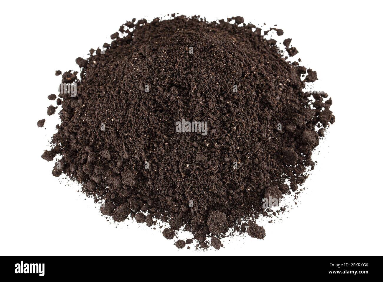 Heap of brown peat, isolated on white background Stock Photo - Alamy