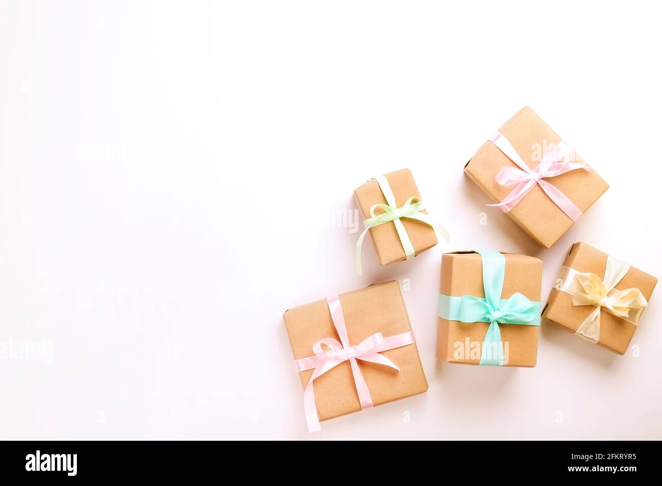 Simple composition with multiple presents wrapped in hand made blank ...