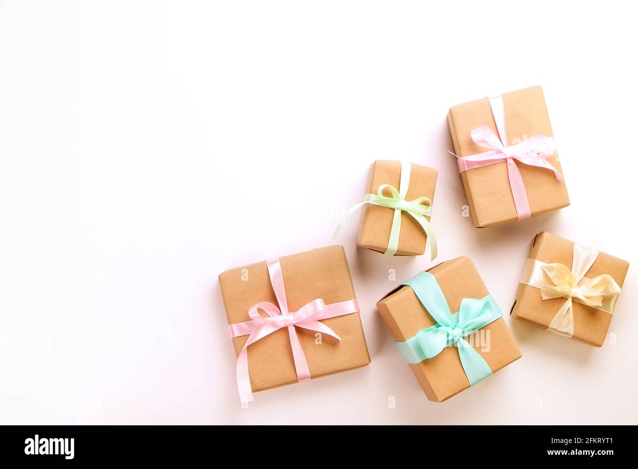 Simple composition with multiple presents wrapped in hand made blank ...