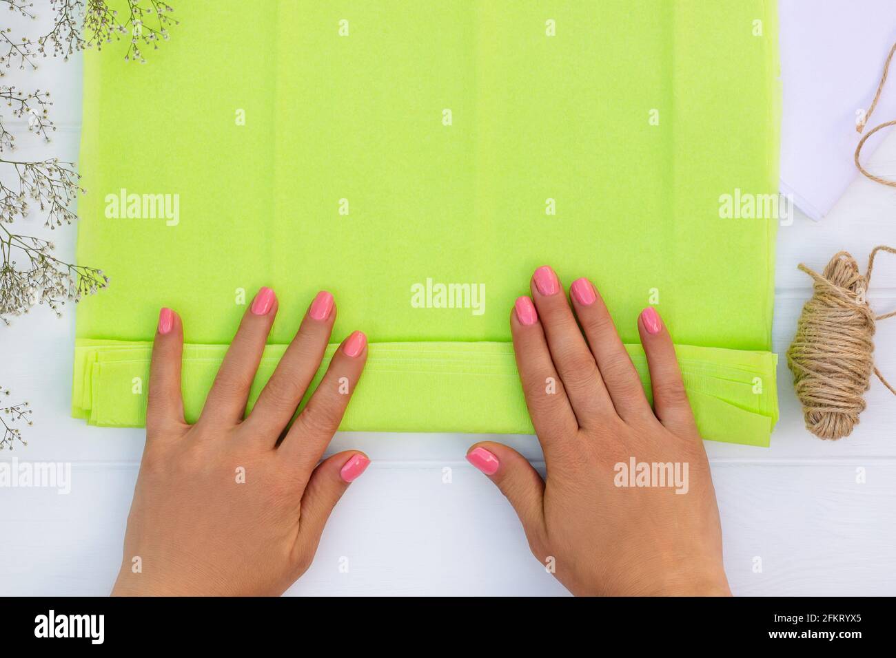 Step by step tutorial on making a light green fluffy pompom from tissue ...