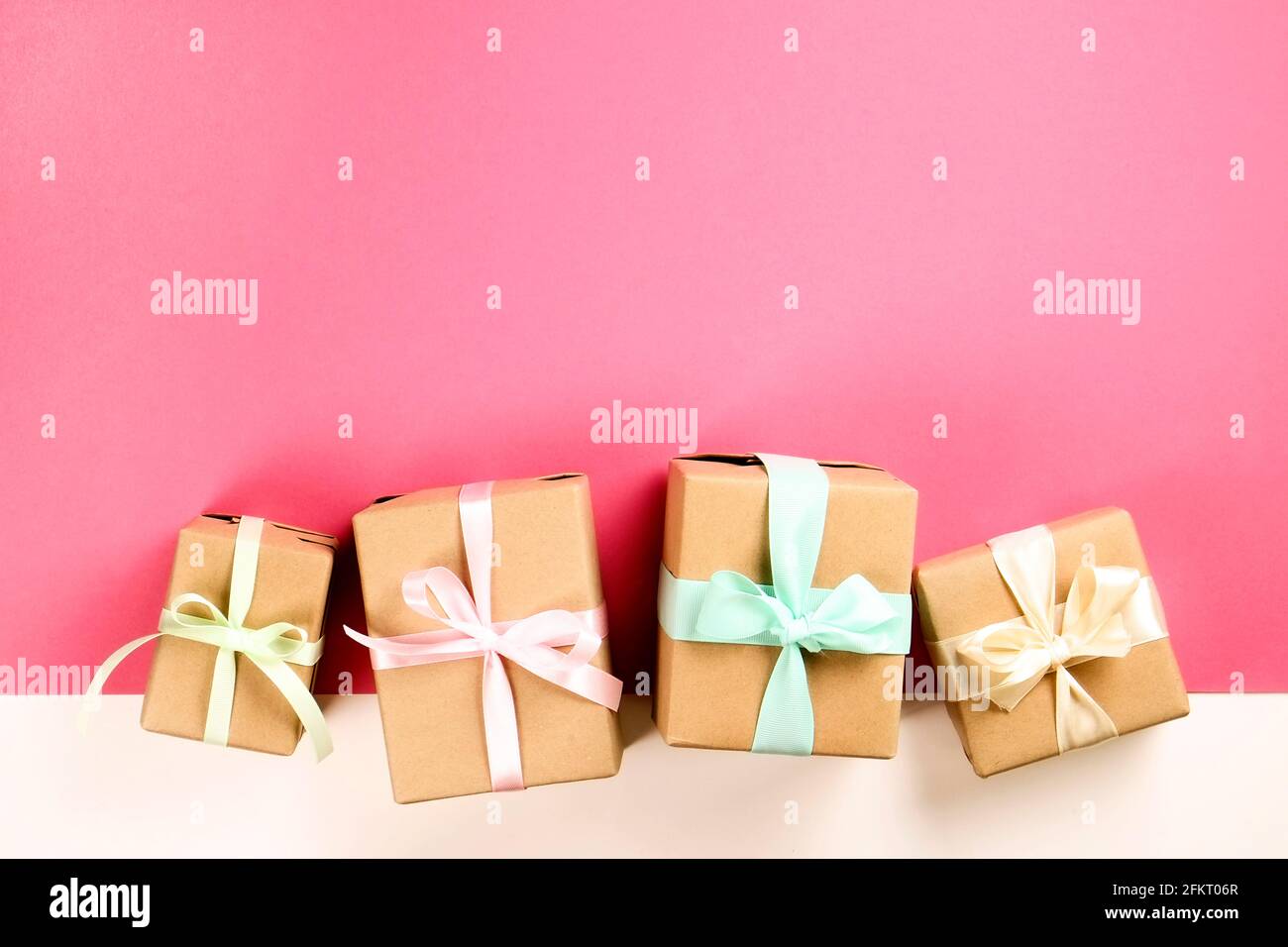 Simple composition with multiple presents wrapped in hand made blank ...