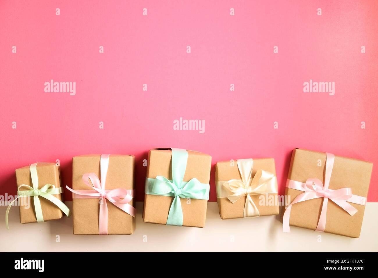 Simple composition with multiple presents wrapped in hand made blank ...
