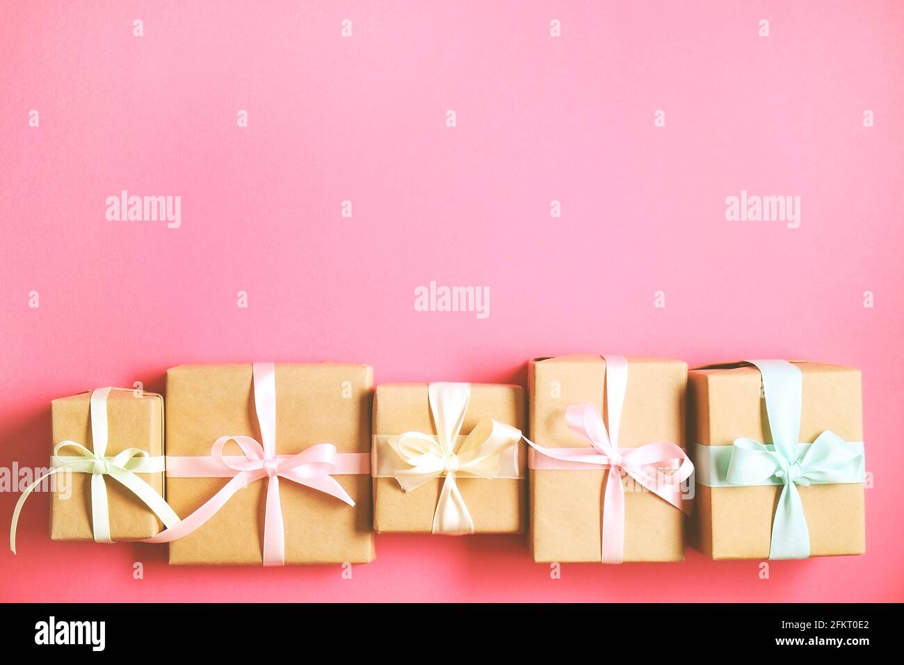 Simple composition with multiple presents wrapped in hand made blank ...