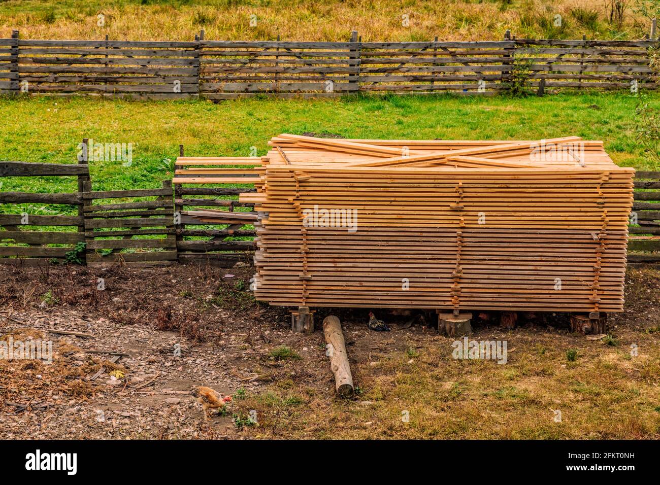 Image of a stack of planks in a country yard Stock Photo - Alamy