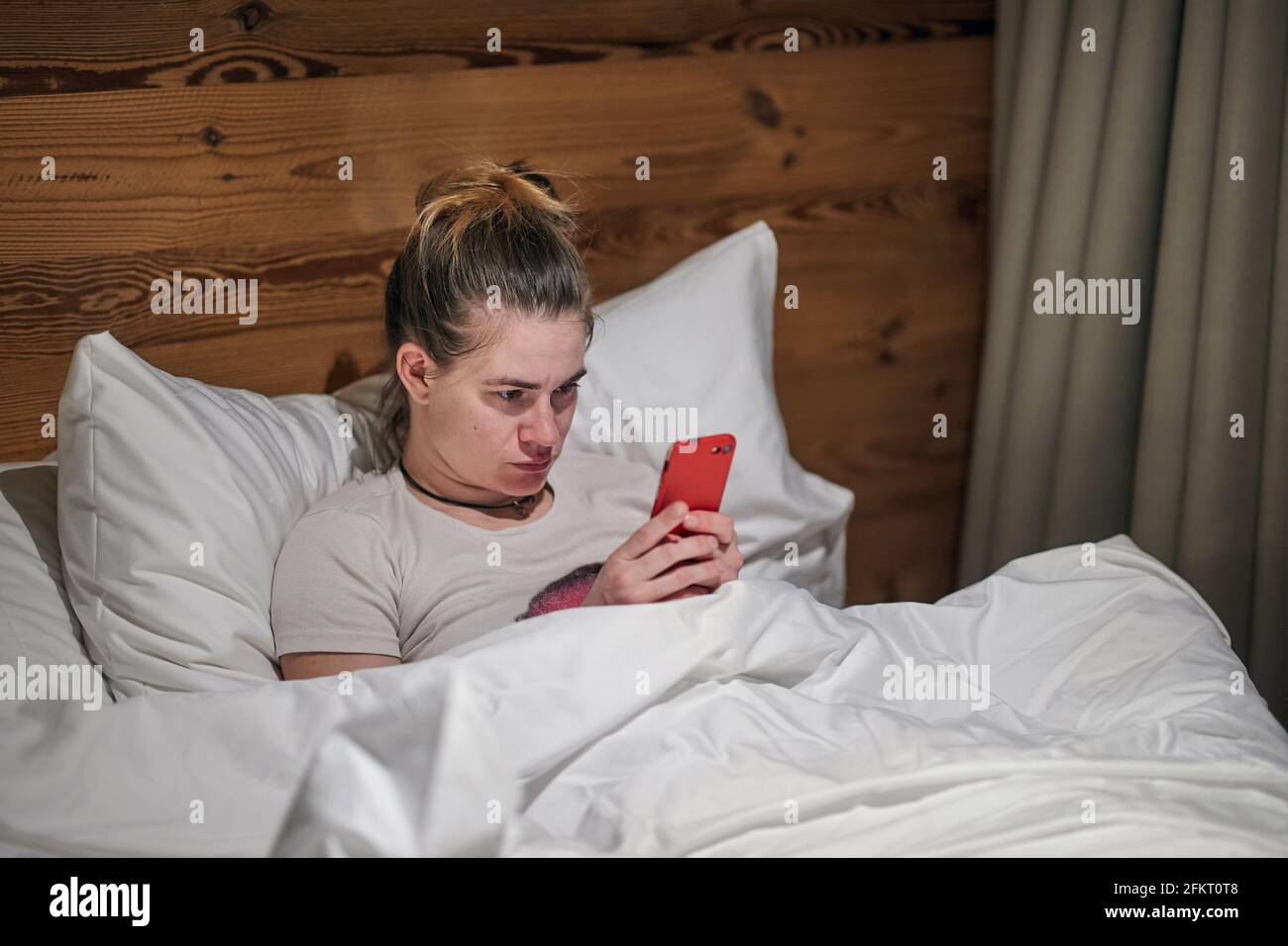 Smartphone usage in bed at night Stock Photo - Alamy