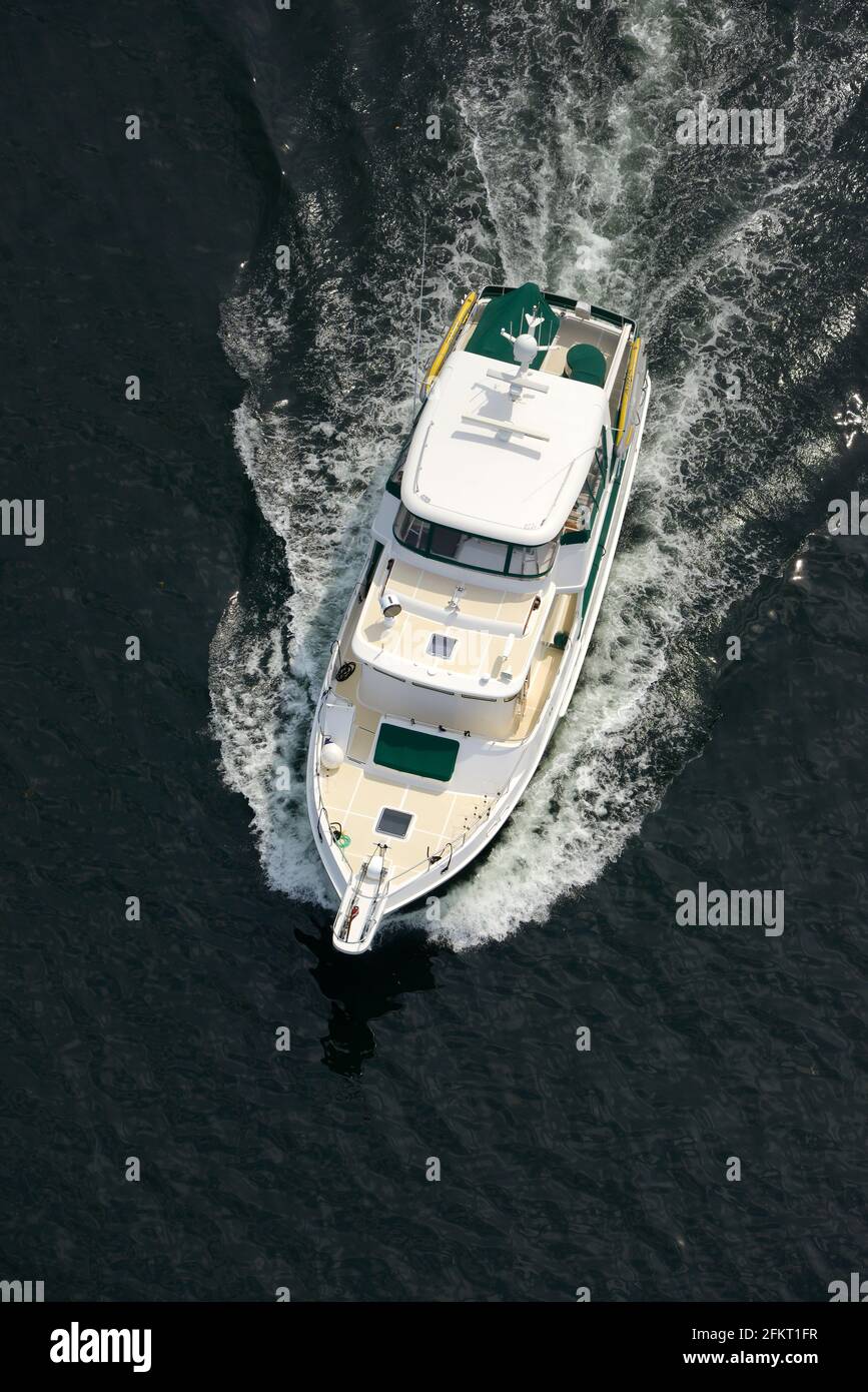 Aerial photograph of a motorboat in the Southern Gulf Islands, British ...