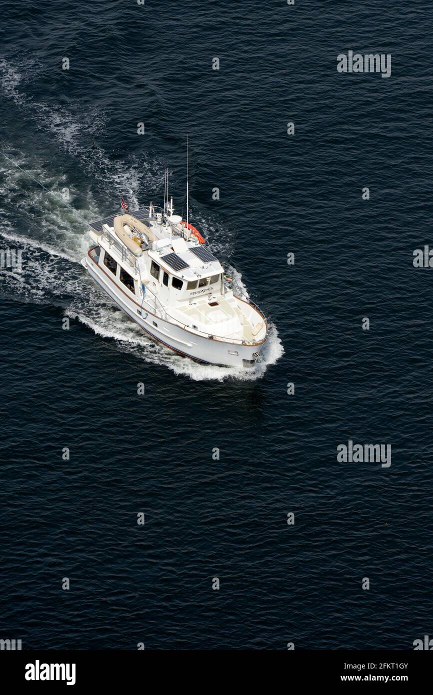 Aerial photo of a motorboat in the Southern Gulf Islands, British ...