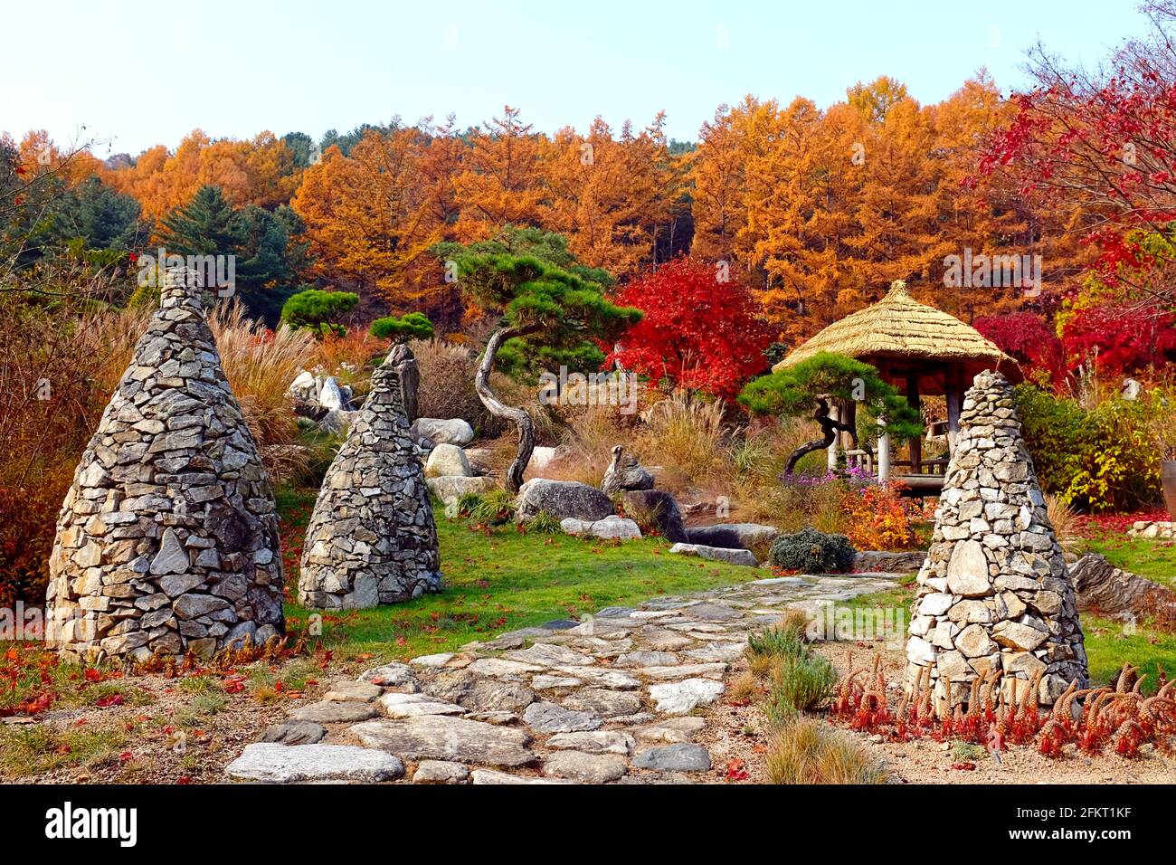 Stone Pagoda in a beautiful garden. Stone stack tower Stock Photo - Alamy