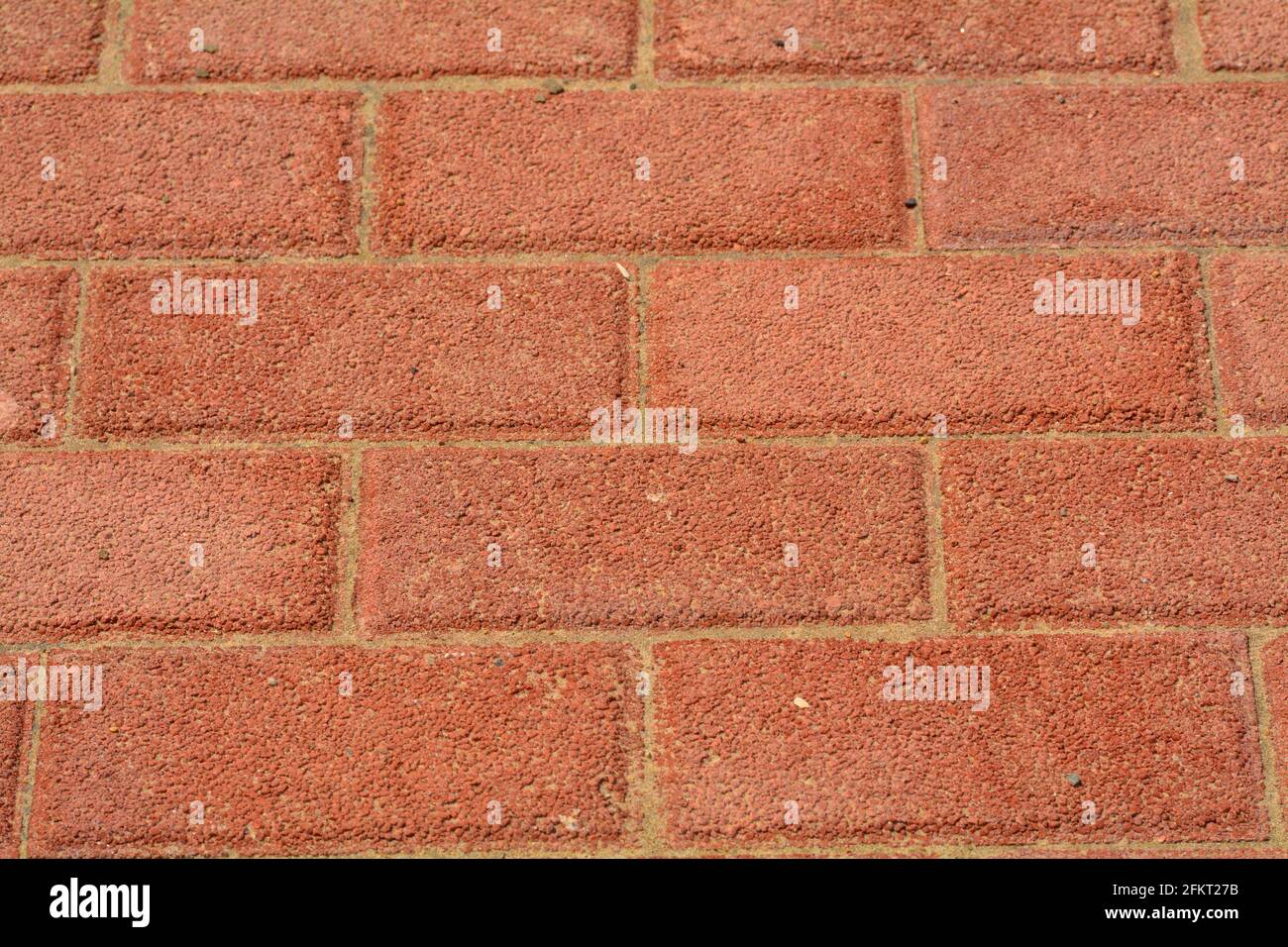 Repetitive red brick paving showing texture and shapes Stock Photo - Alamy