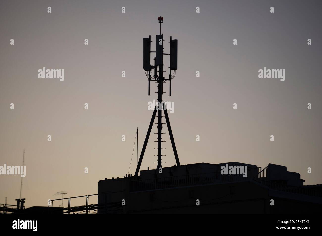 Cellular transmitters on top of building with a blue sky morning Stock ...