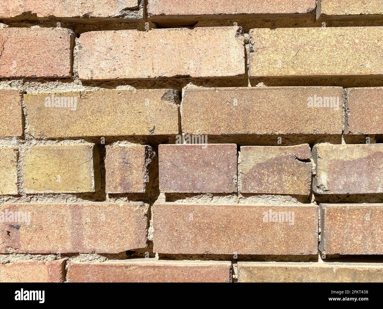 old decayed weathered old brick block garden building wall cracked and ...