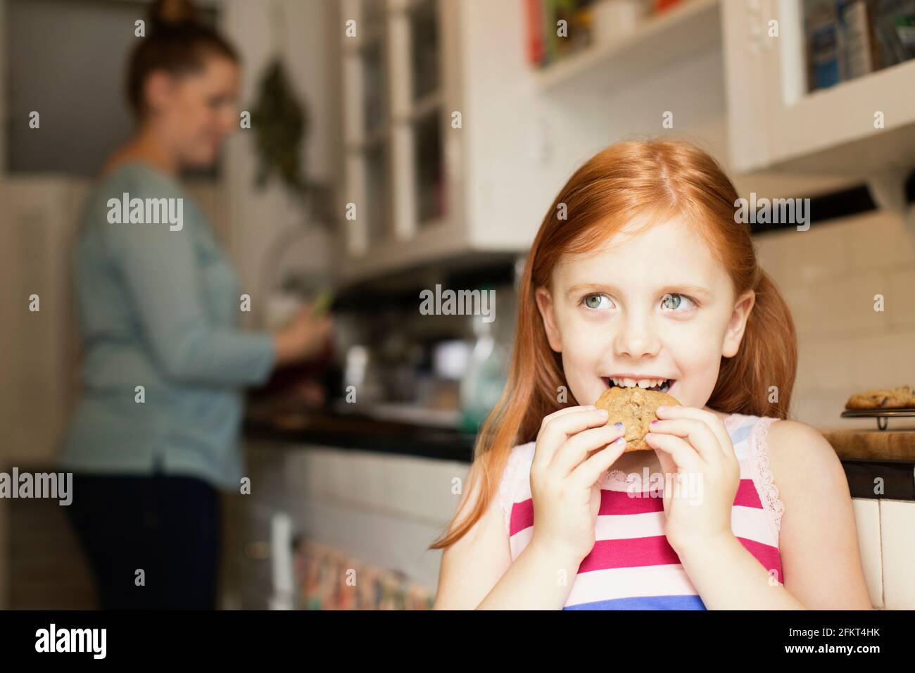 Girl eating biscuit hi-res stock photography and images - Alamy