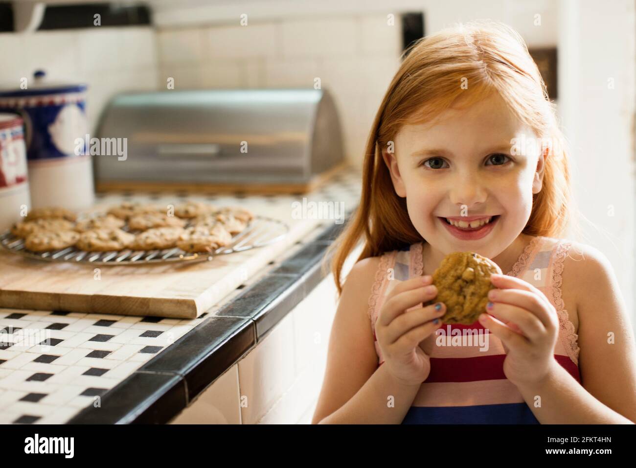 Girl eating biscuit hi-res stock photography and images - Alamy