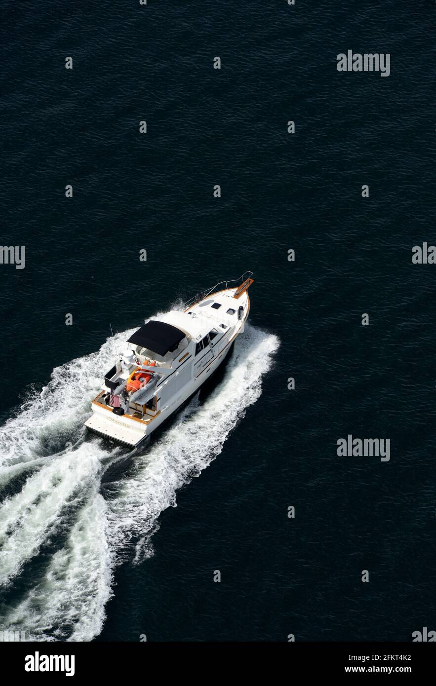 Aerial photo of a motorboat in the Southern Gulf Islands, British ...
