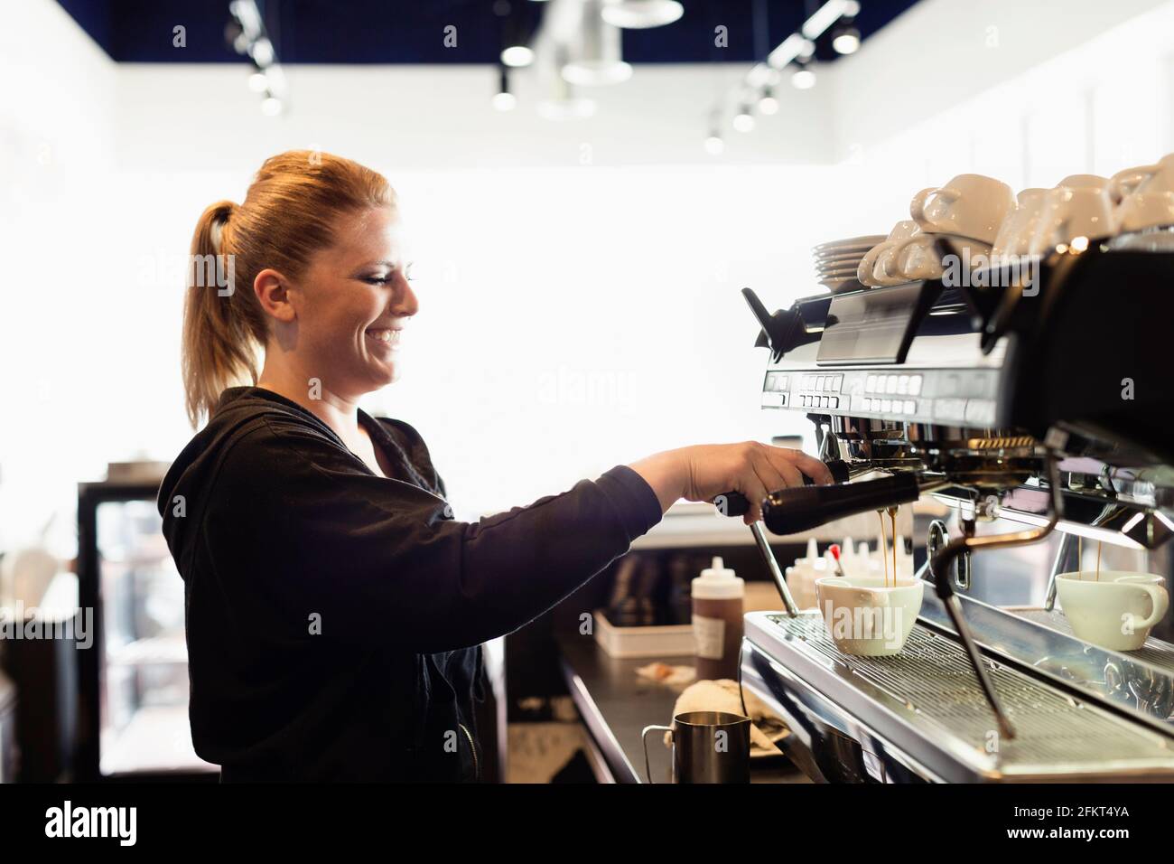 Coffee shop barista making coffee Stock Photo - Alamy