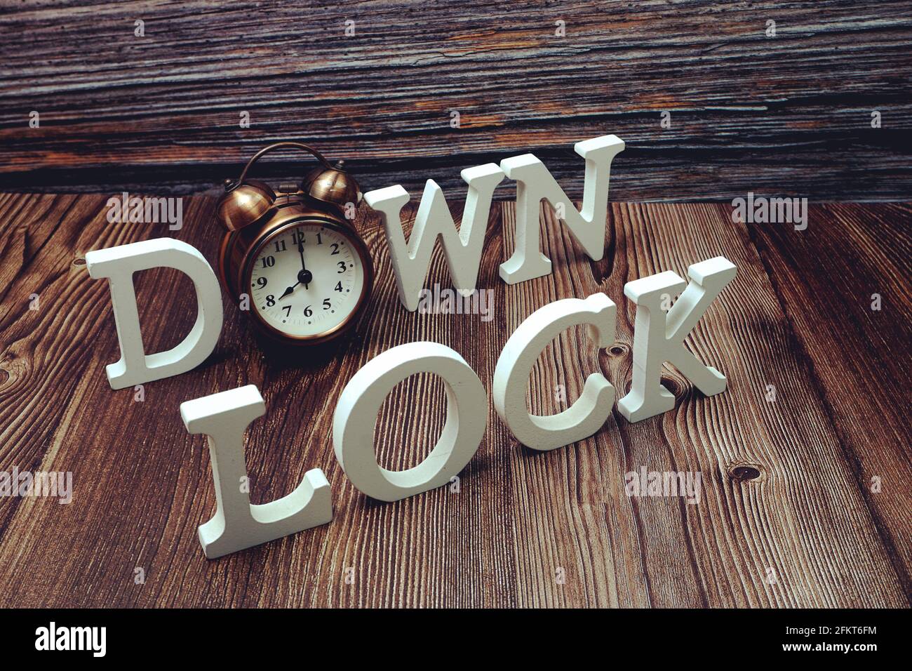 Lockdown alphabet letters with alarm clock on wooden background Stock ...