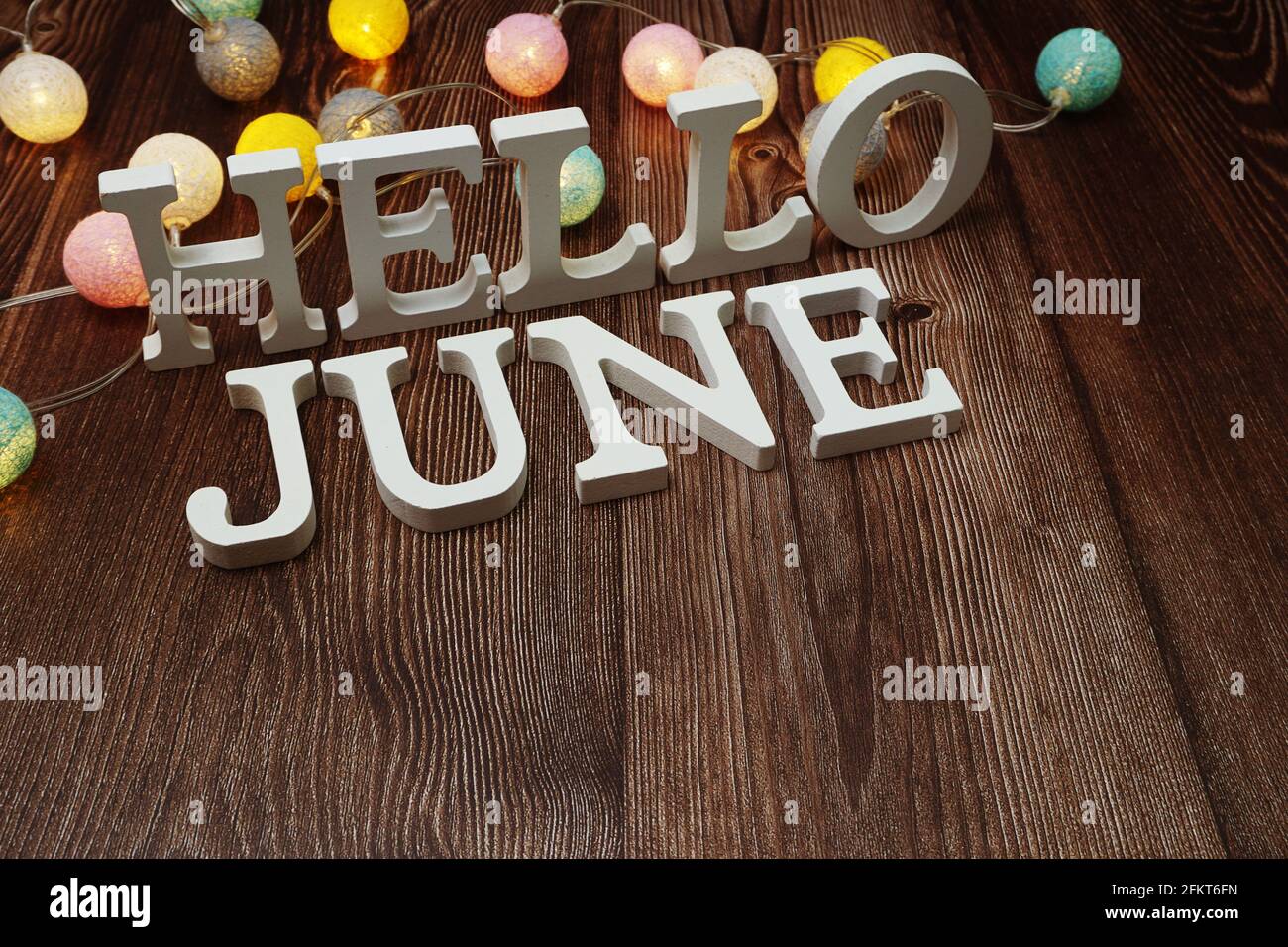 Hello June alphabet letters with LED cotton balls decoration on wooden ...