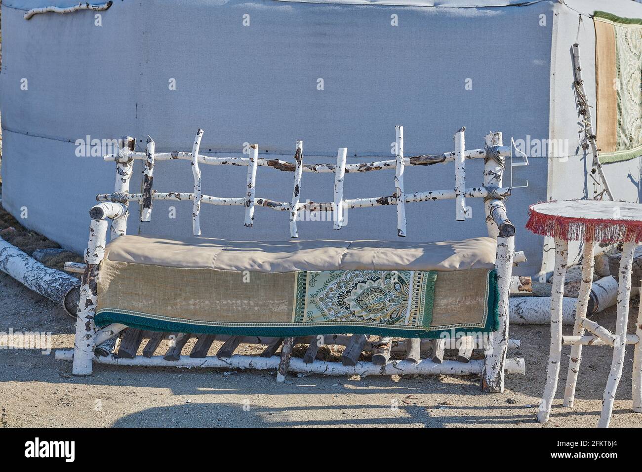 bench made of birch logs near the yurt Stock Photo - Alamy