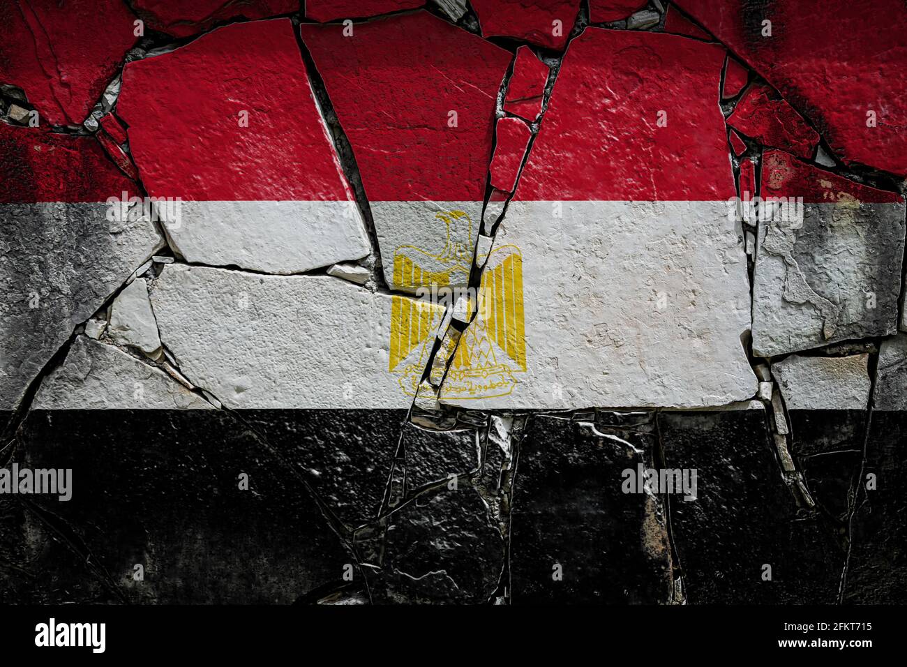 National flag of Egypt depicting in paint colors on an old stone wall ...