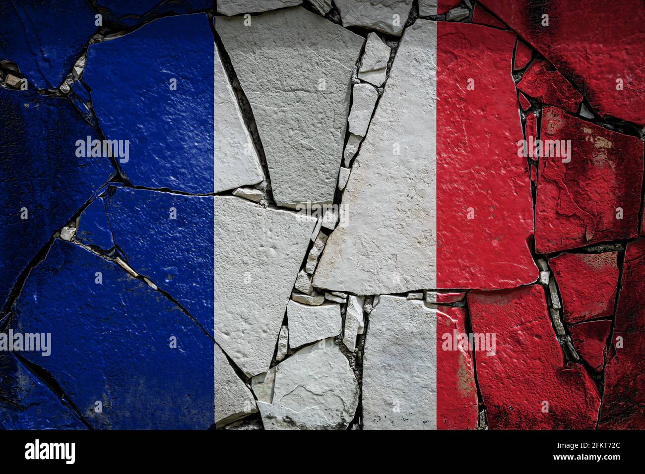 National flag of France depicting in paint colors on an old stone wall ...