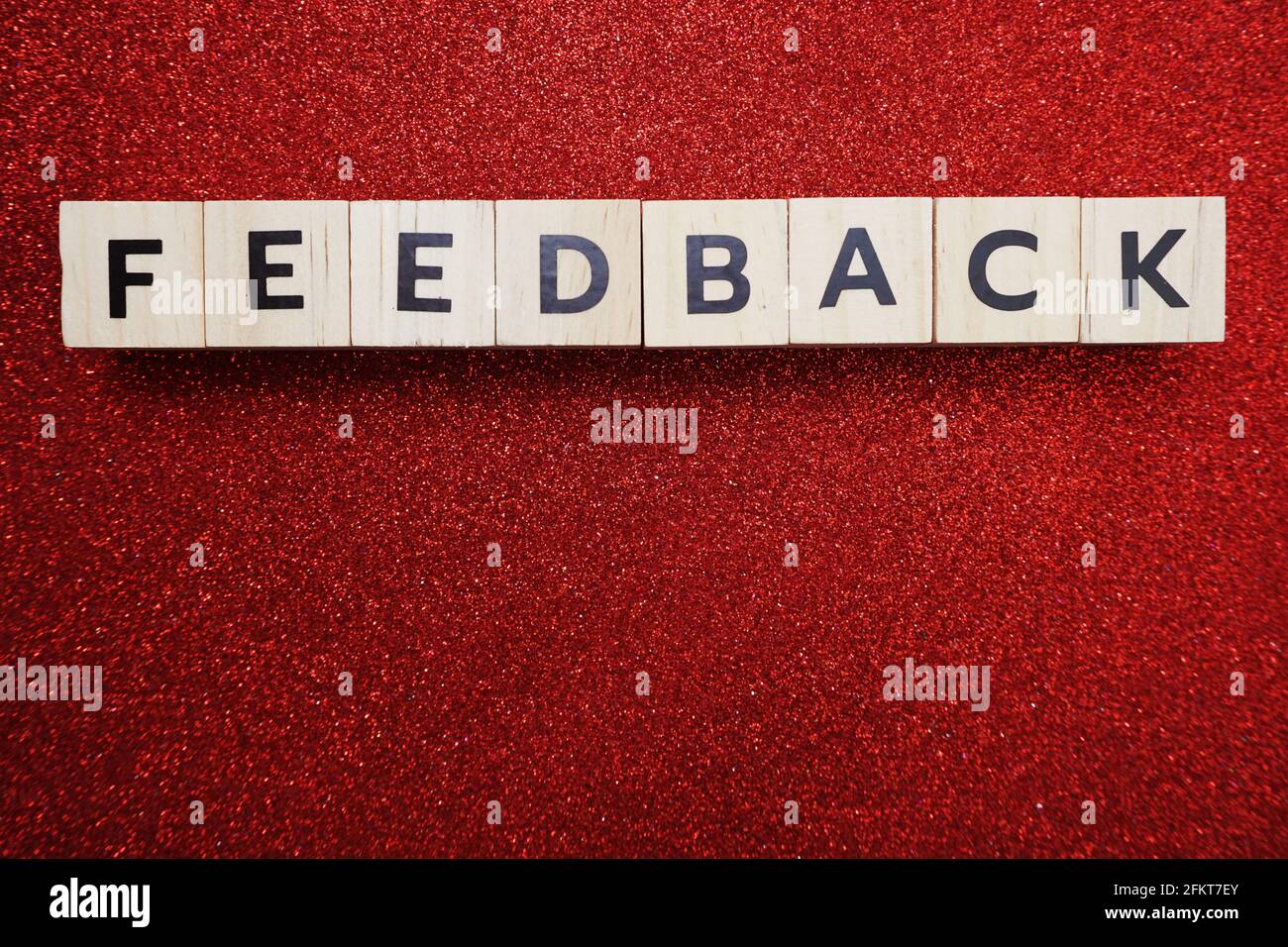 Feedback alphabet letters top view on red glitter background Stock ...