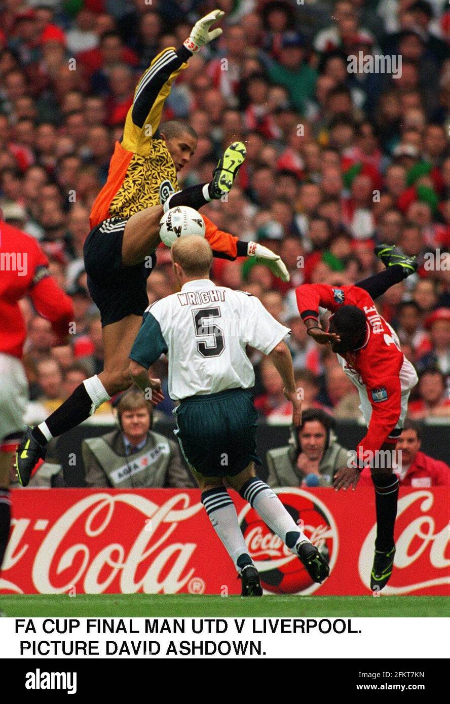 David James the Liverpool goalkeeper flies in the air to clear the ball ...