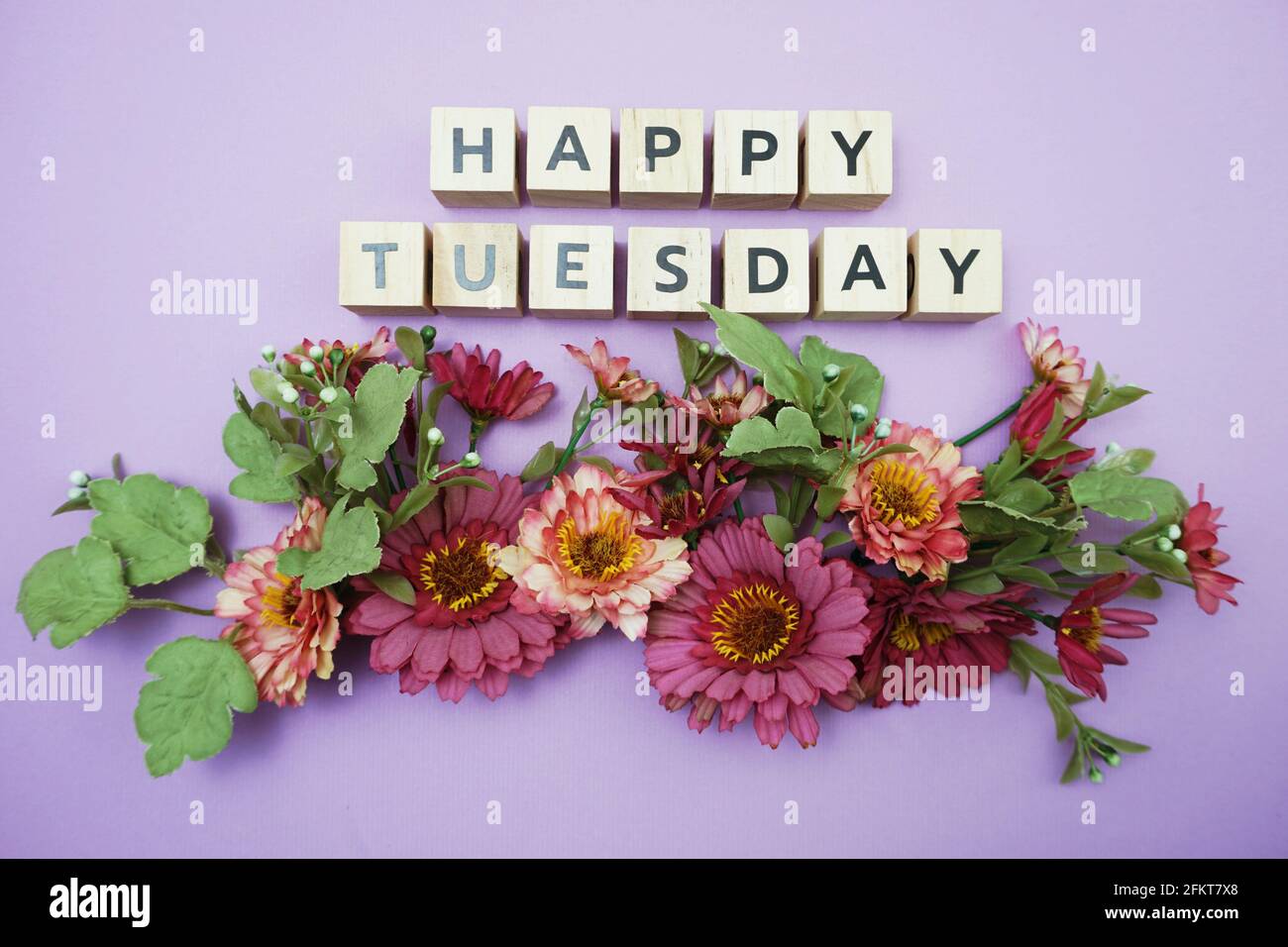 Happy Turesday alphabet letters with flower decoration top view on ...
