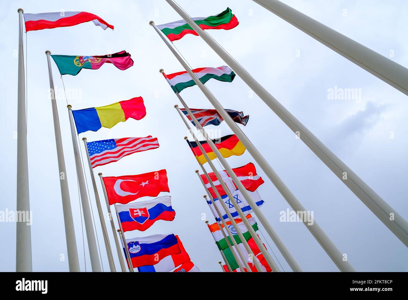 Flags of different countries on flagpoles Stock Photo - Alamy