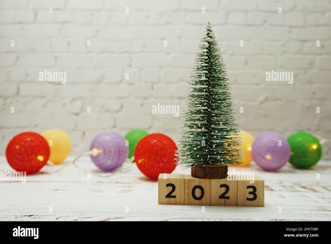 Happy New Year 2023 festive background with christmas tree on white ...