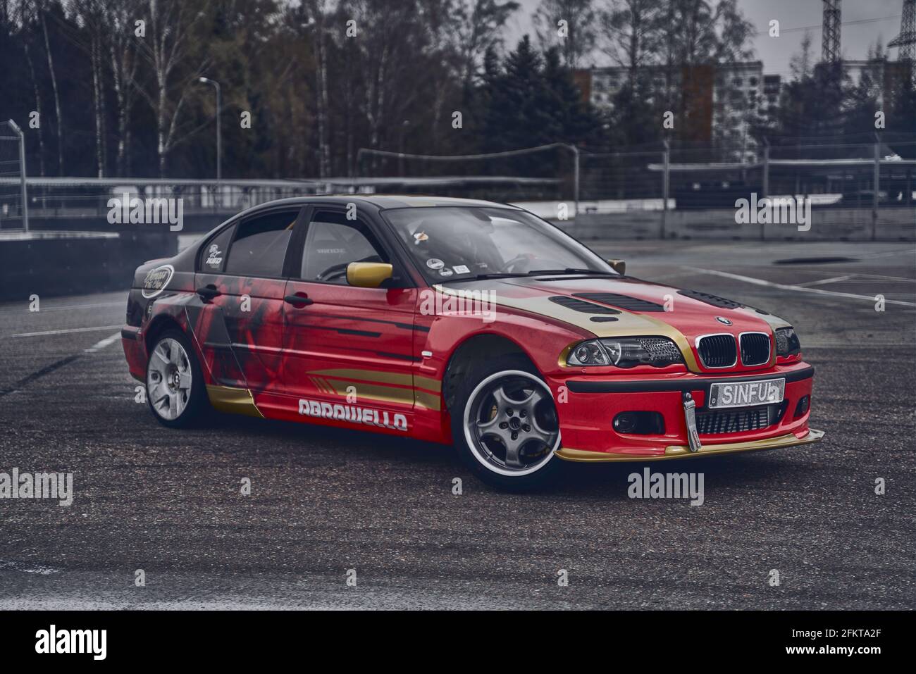 Front side view of black car driving fast Stock Photo - Alamy