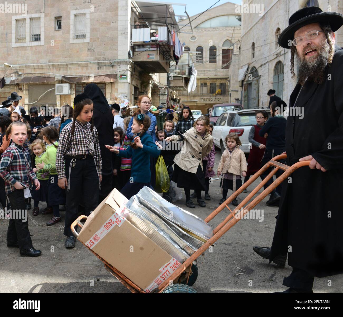Jewish Orthodox children waiting in line for food and sweets served by ...