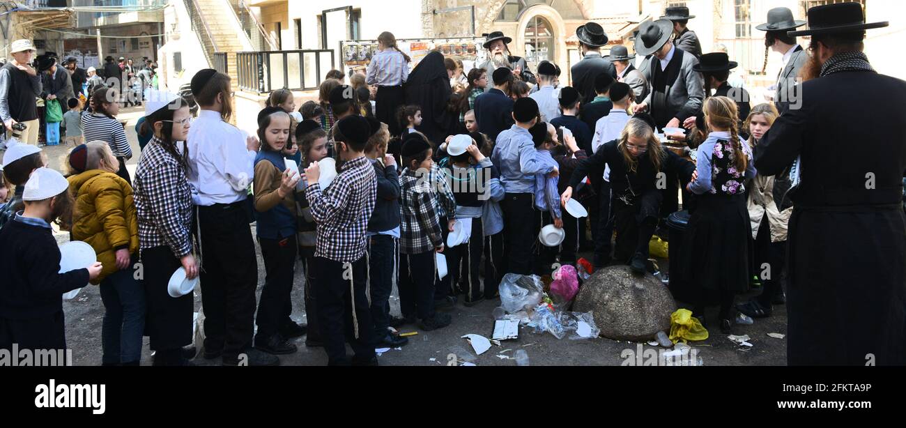 Jewish Orthodox children waiting in line for food and sweets served by ...