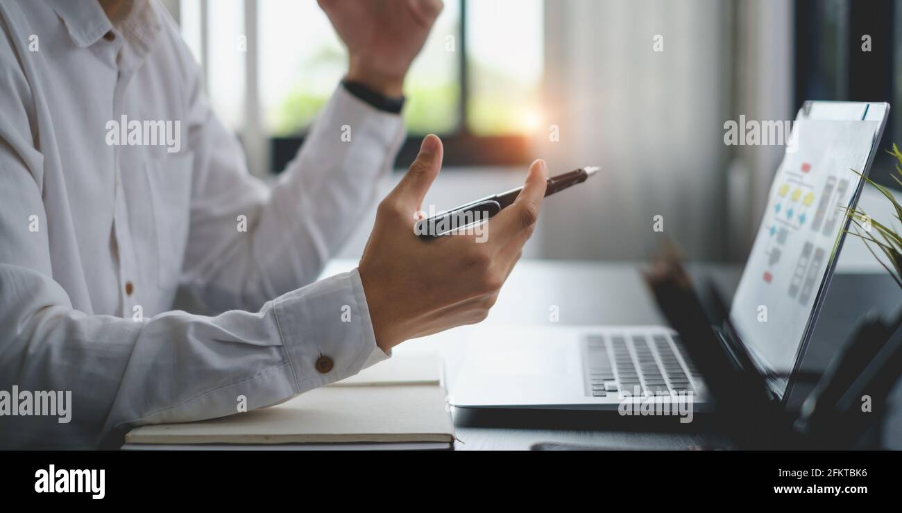 Man ux developer and ui designer makeing flow chart and interface app ...