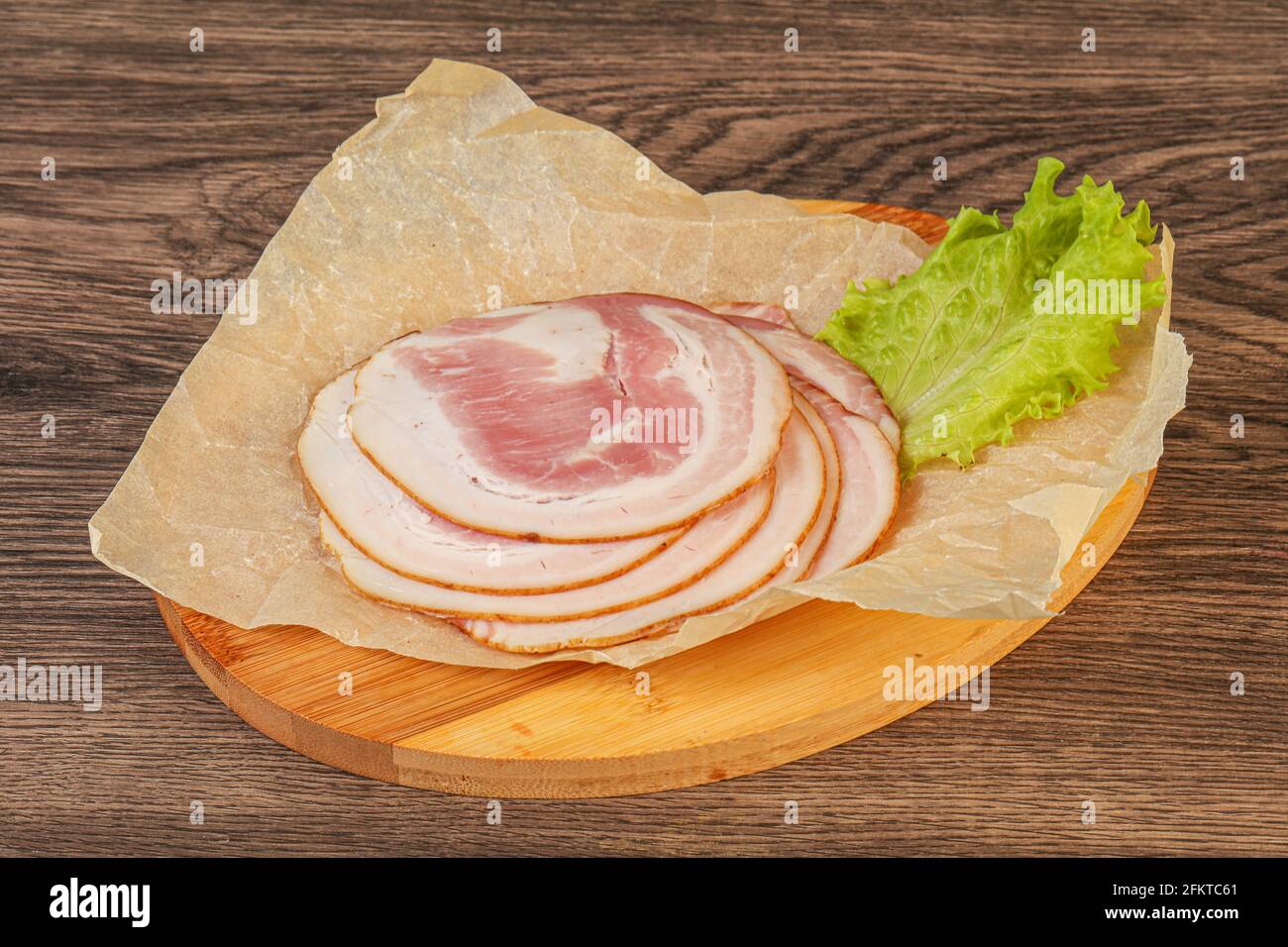 Sliced Italian Pancetta sausage over board Stock Photo - Alamy