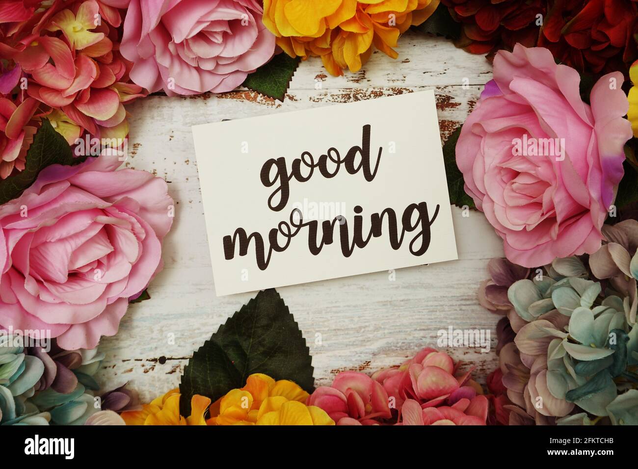 Good Morning Card with colorful flowers border frame on wooden ...