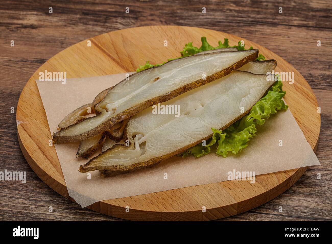 Delicous smoked halibut fish slices snack Stock Photo - Alamy