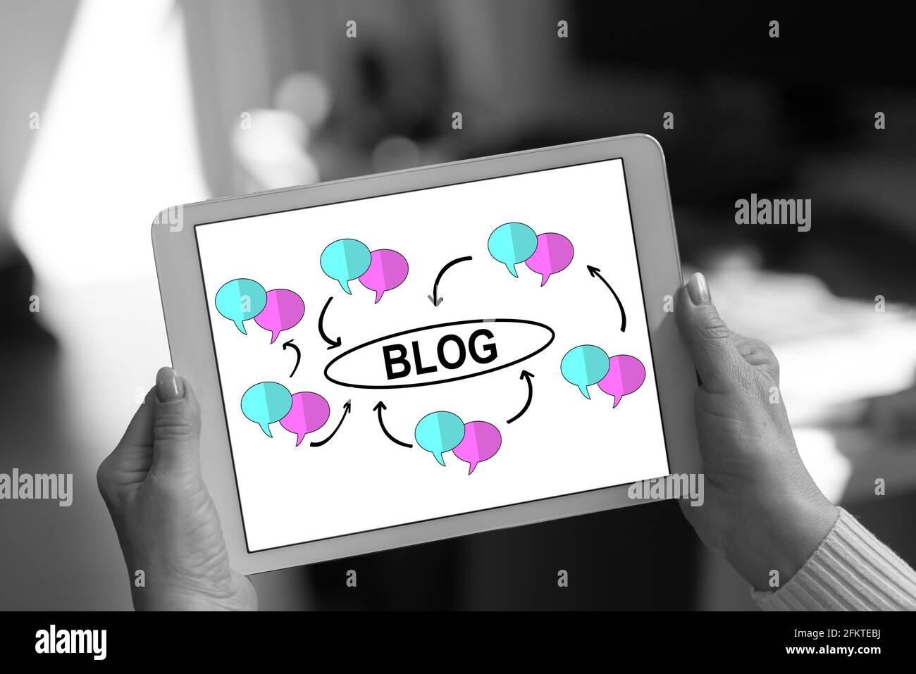 Blog concept shown on a tablet held by a woman Stock Photo - Alamy