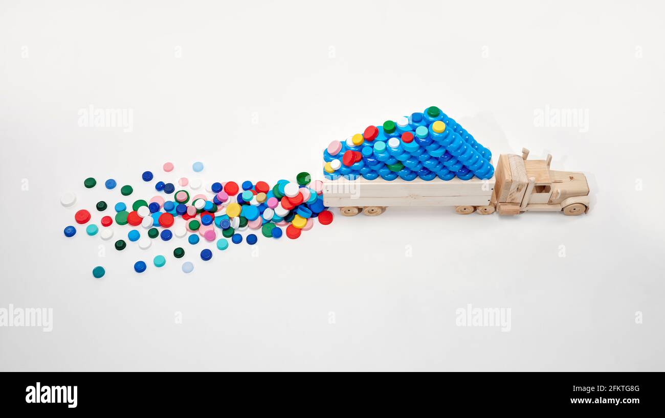 Wooden truck carries plastic caps. Plastic city concept. Plastic-free ...
