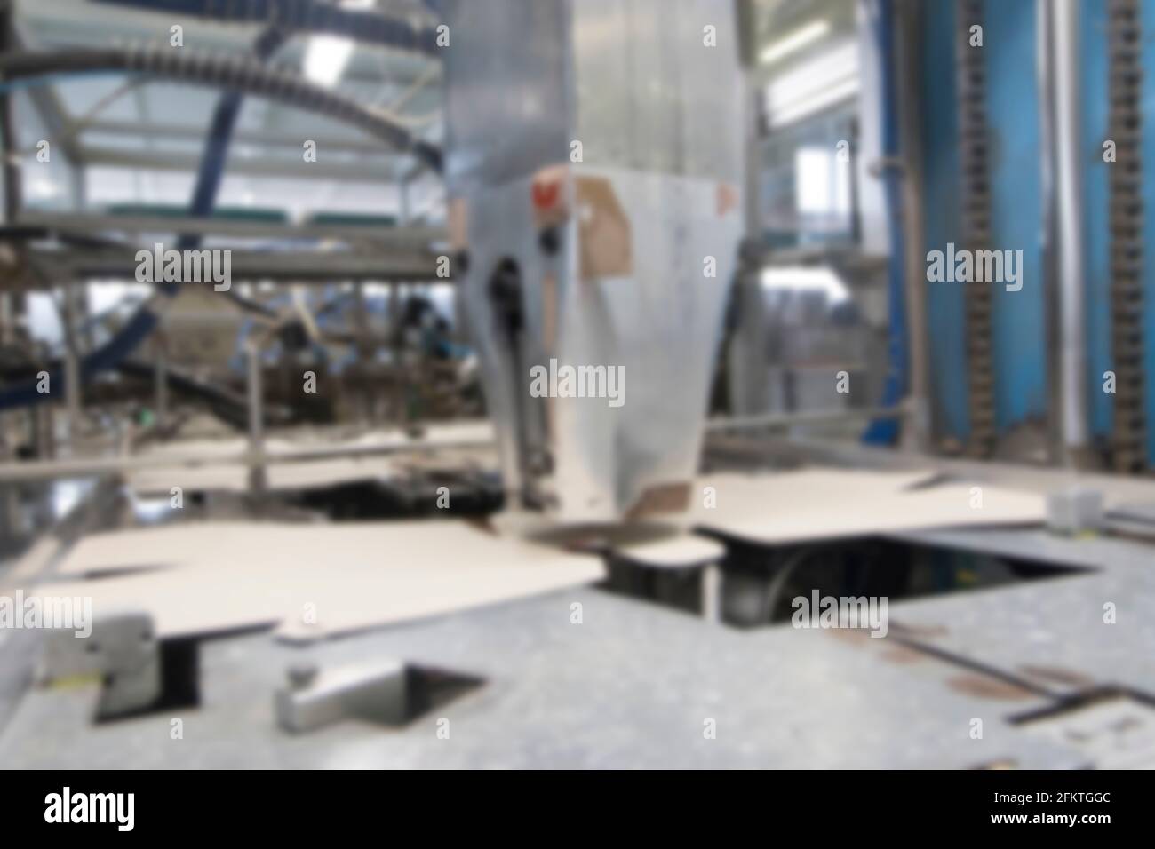Blurred image showing the interior or a production facility, no people ...
