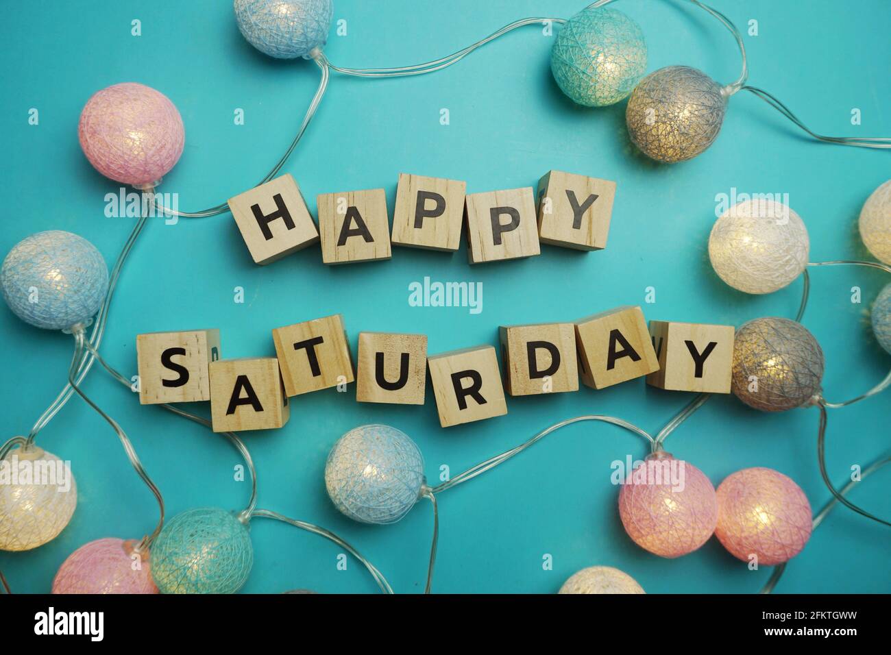 Happy Saturday alphabet letter with LED Cotton ball Decoration on blue ...