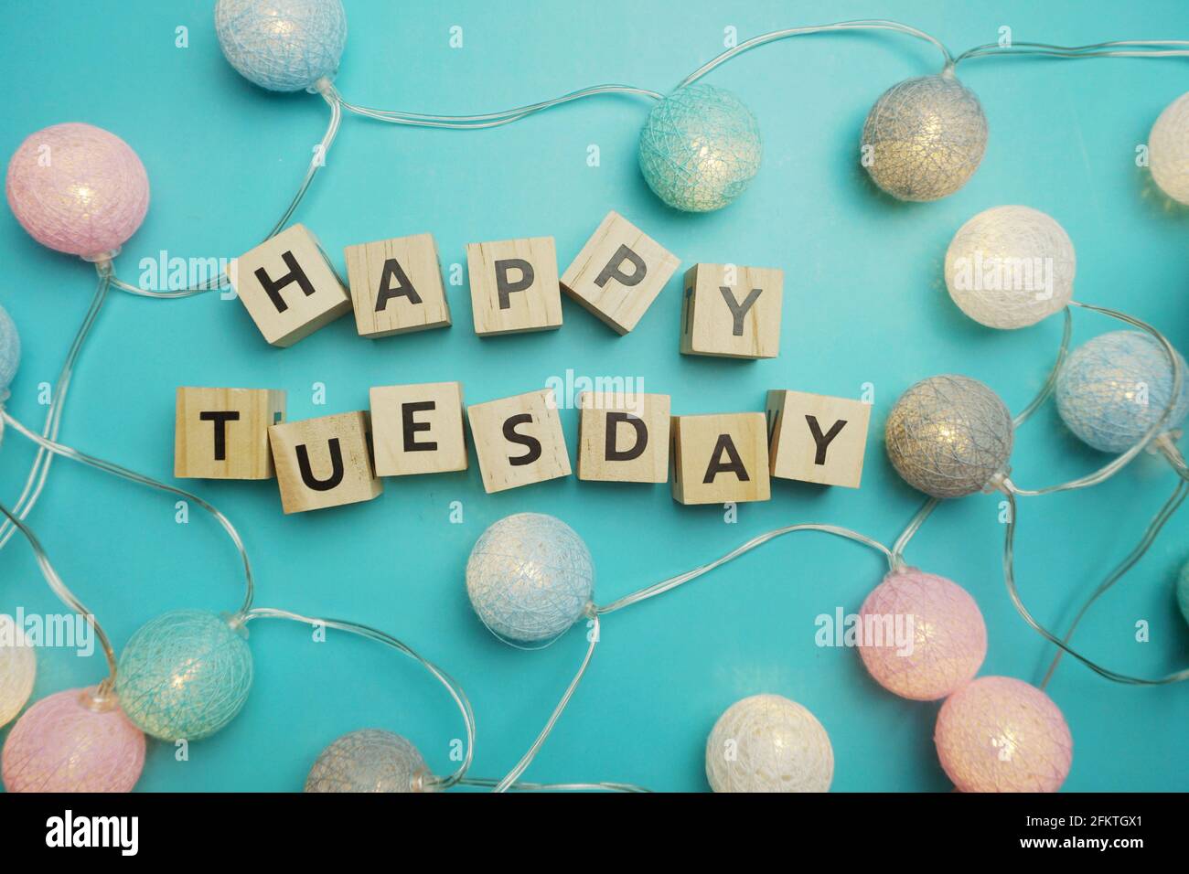 Happy Tuesday alphabet letter with LED Cotton ball Decoration on blue ...