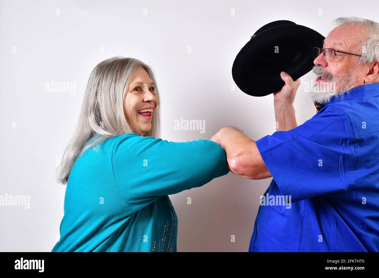 Couple doing the elbow bump to greet each other - concept of the new ...