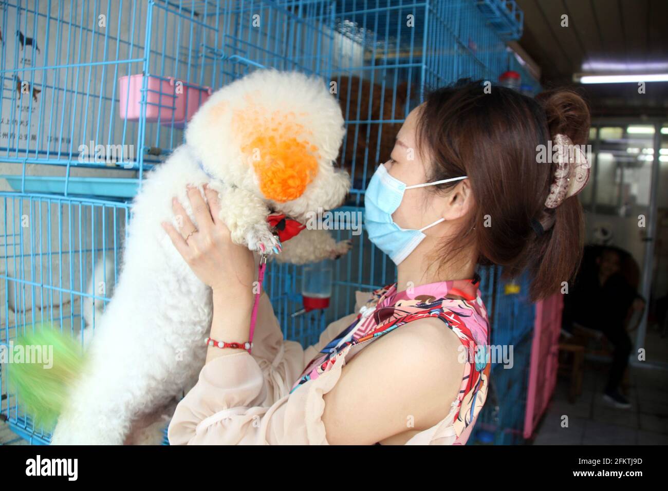 SUZHOU, CHINA - MAY 4, 2021 - A girl bids farewell to her foster dog at ...